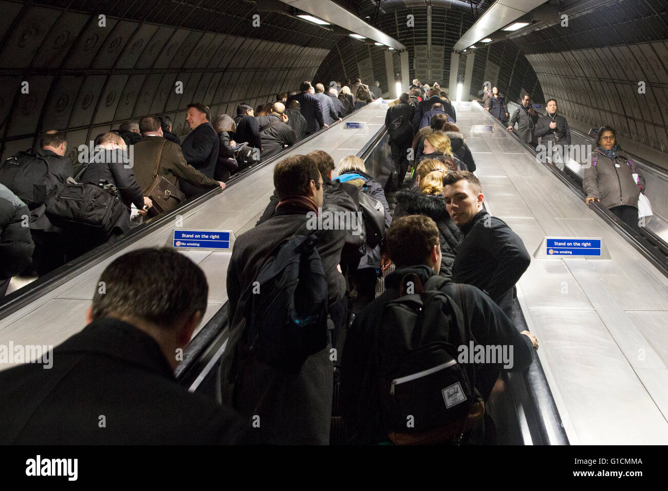 Commuters traveling up the escalator at London Bridge tube station ...