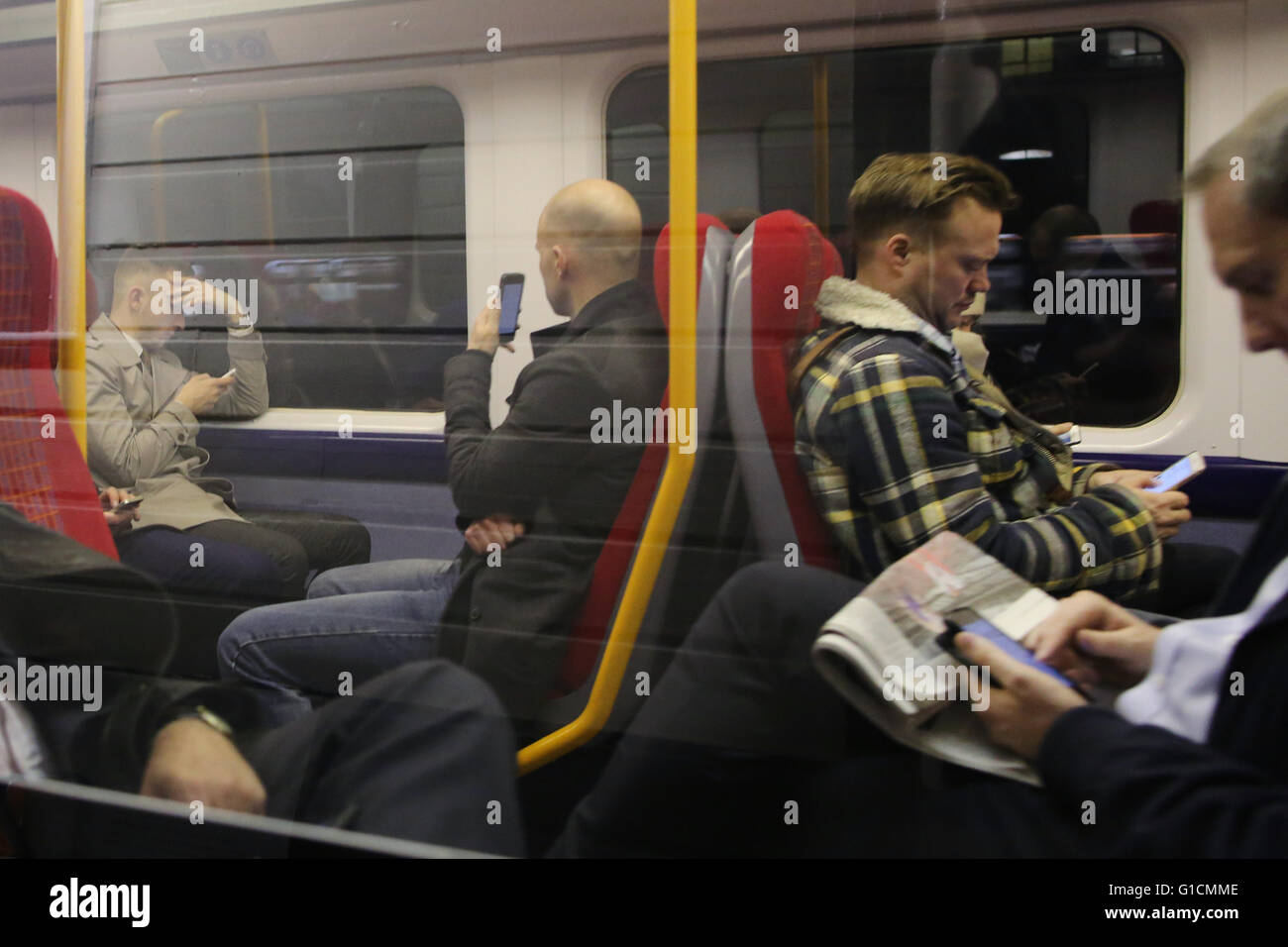 Commuters on the train, Waterloo station,London,UK Stock Photo - Alamy