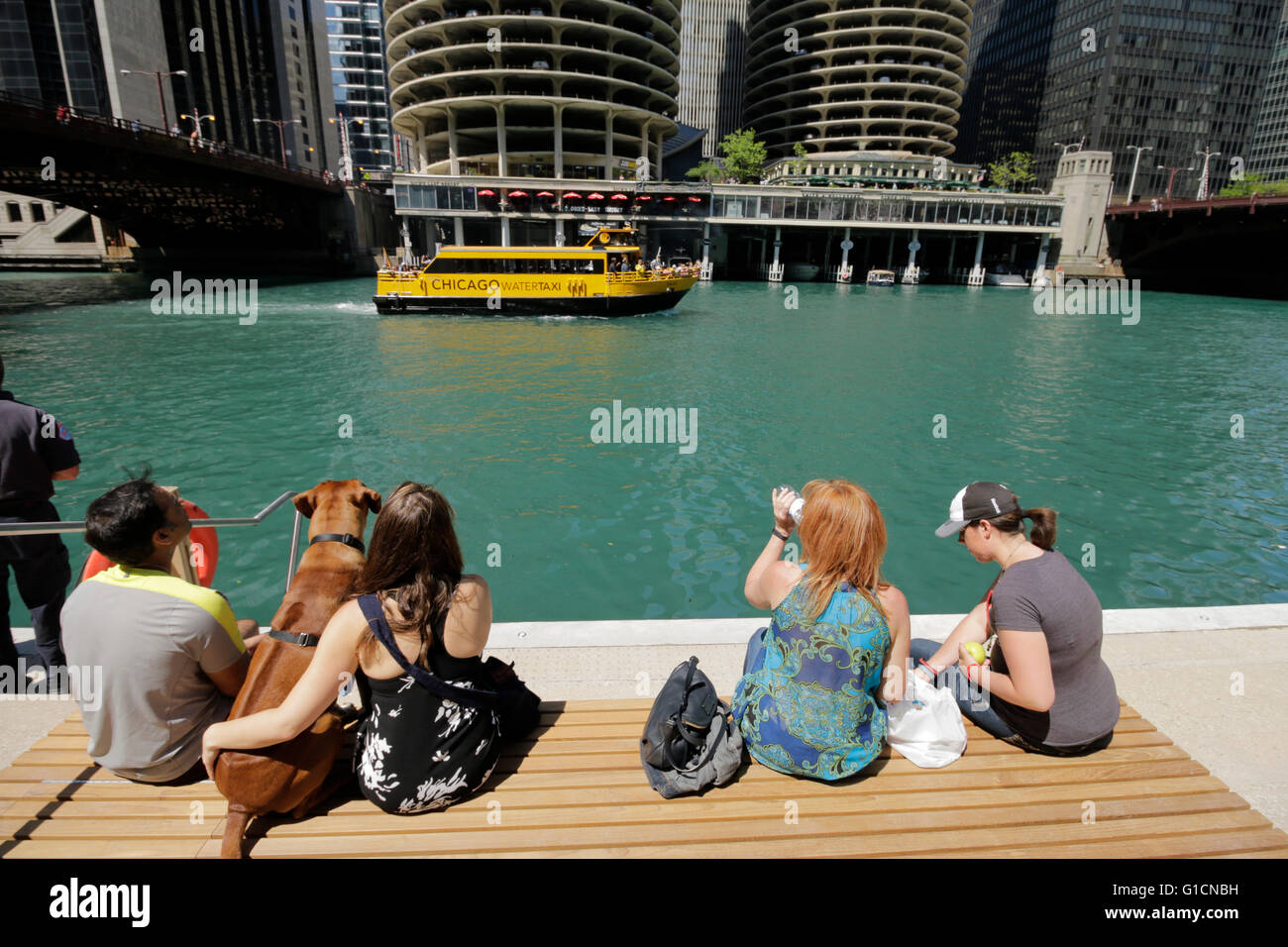 People enjoying a warm spring day on the Chicago Riverwalk Stock Photo ...