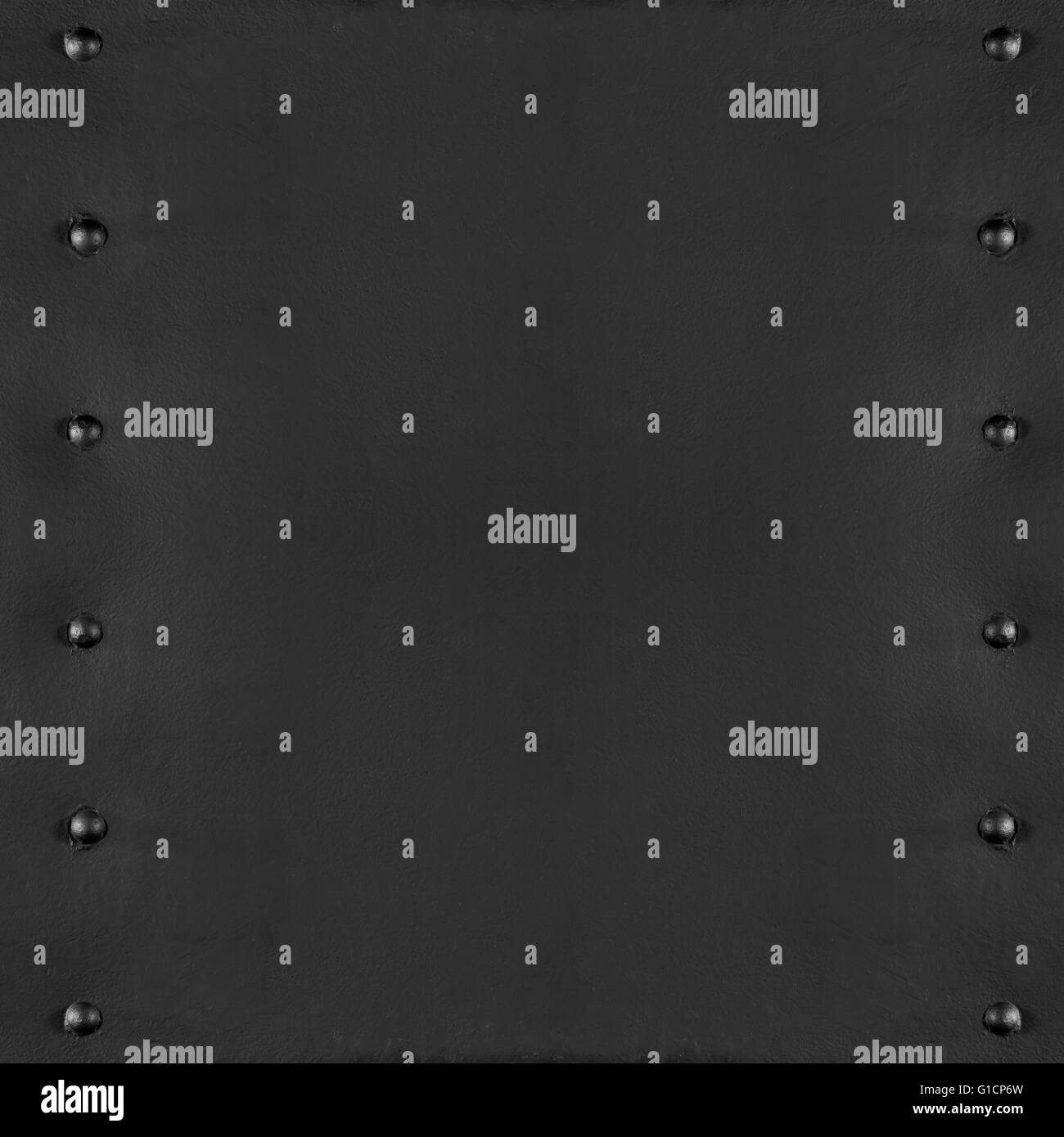 abstract black background or smooth metal plate texture with rivets ...