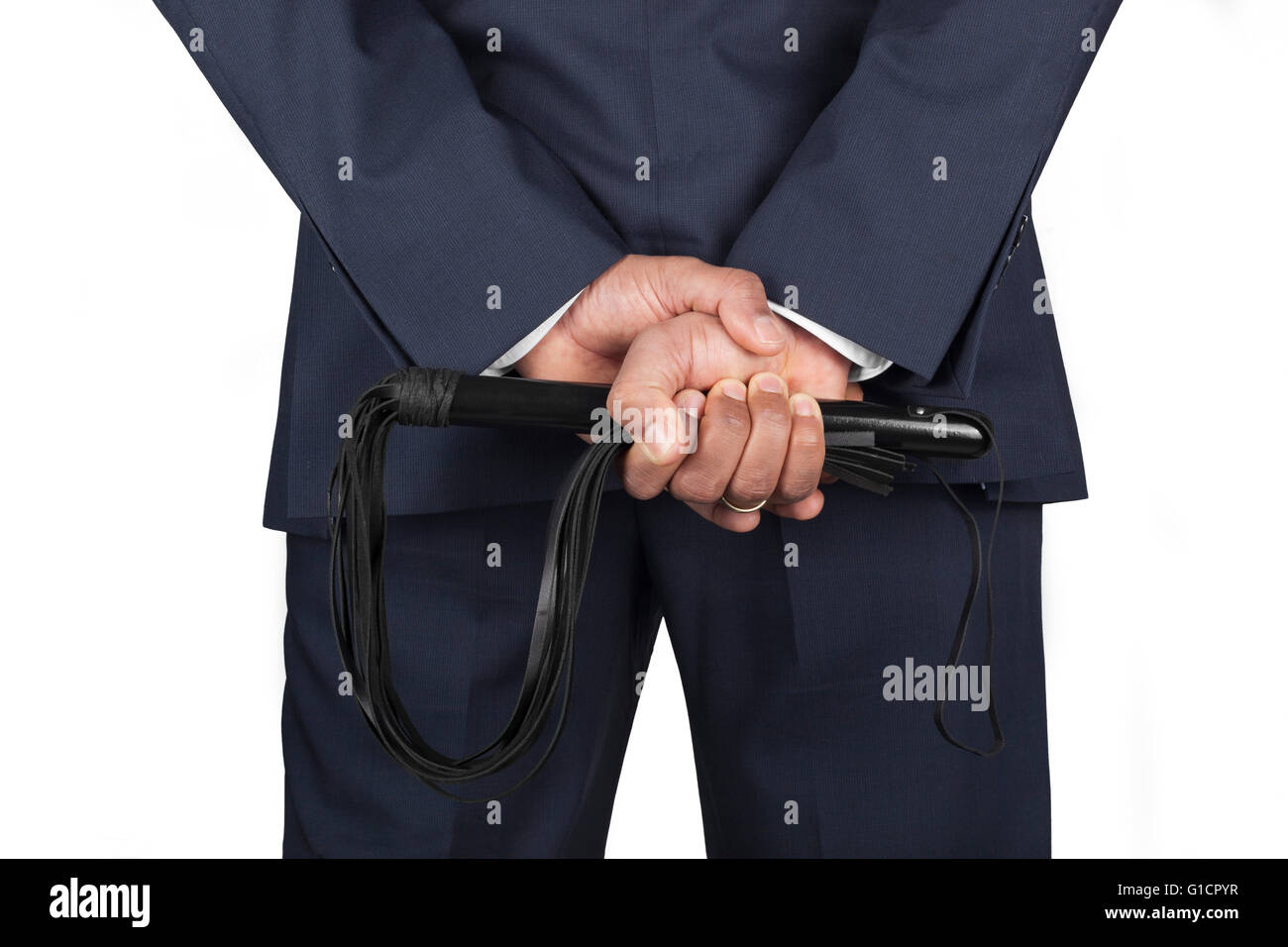 Leather whip held by dominant master in a suit Stock Photo - Alamy