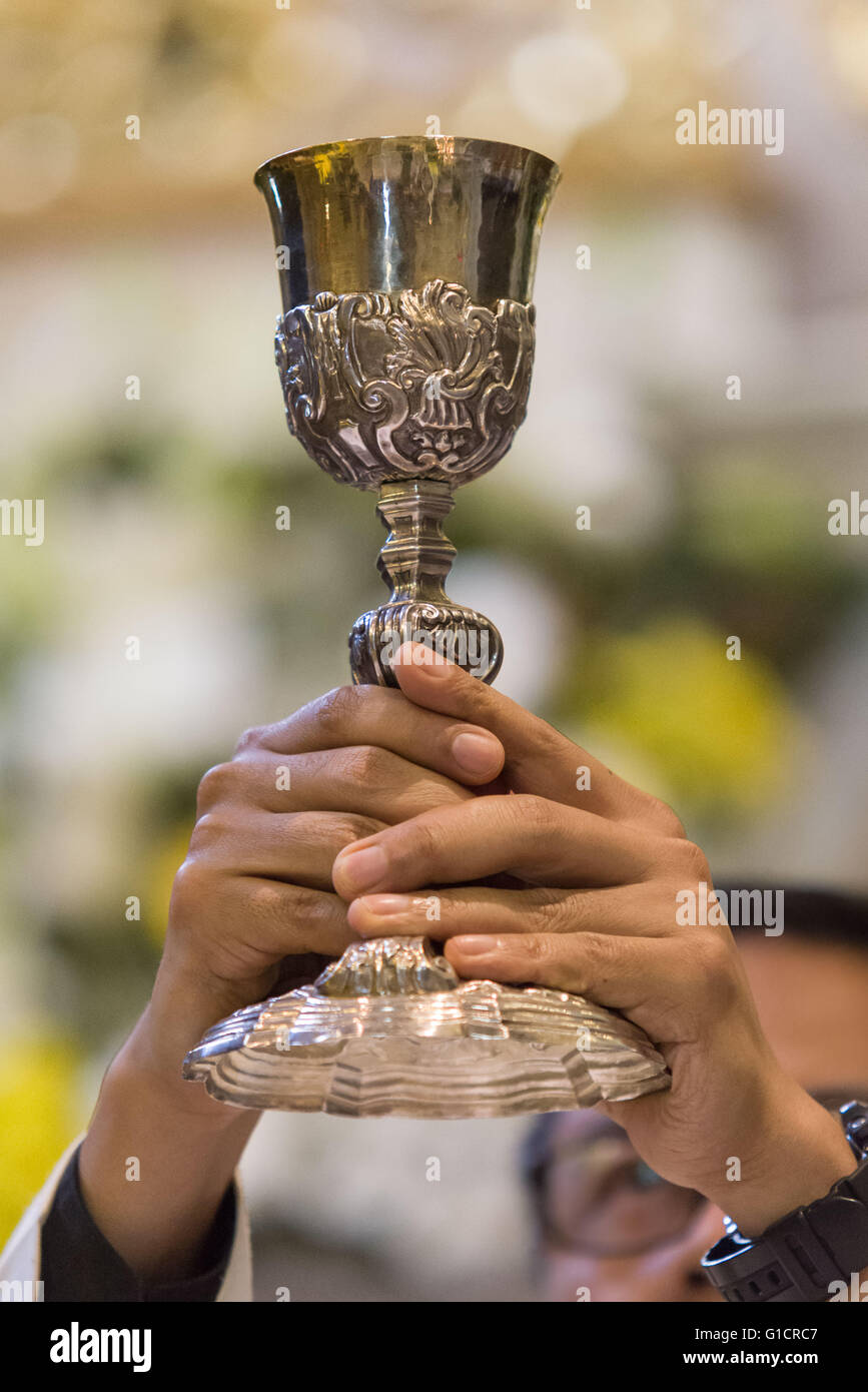 The christian rite of the Communion during the mass Stock Photo - Alamy