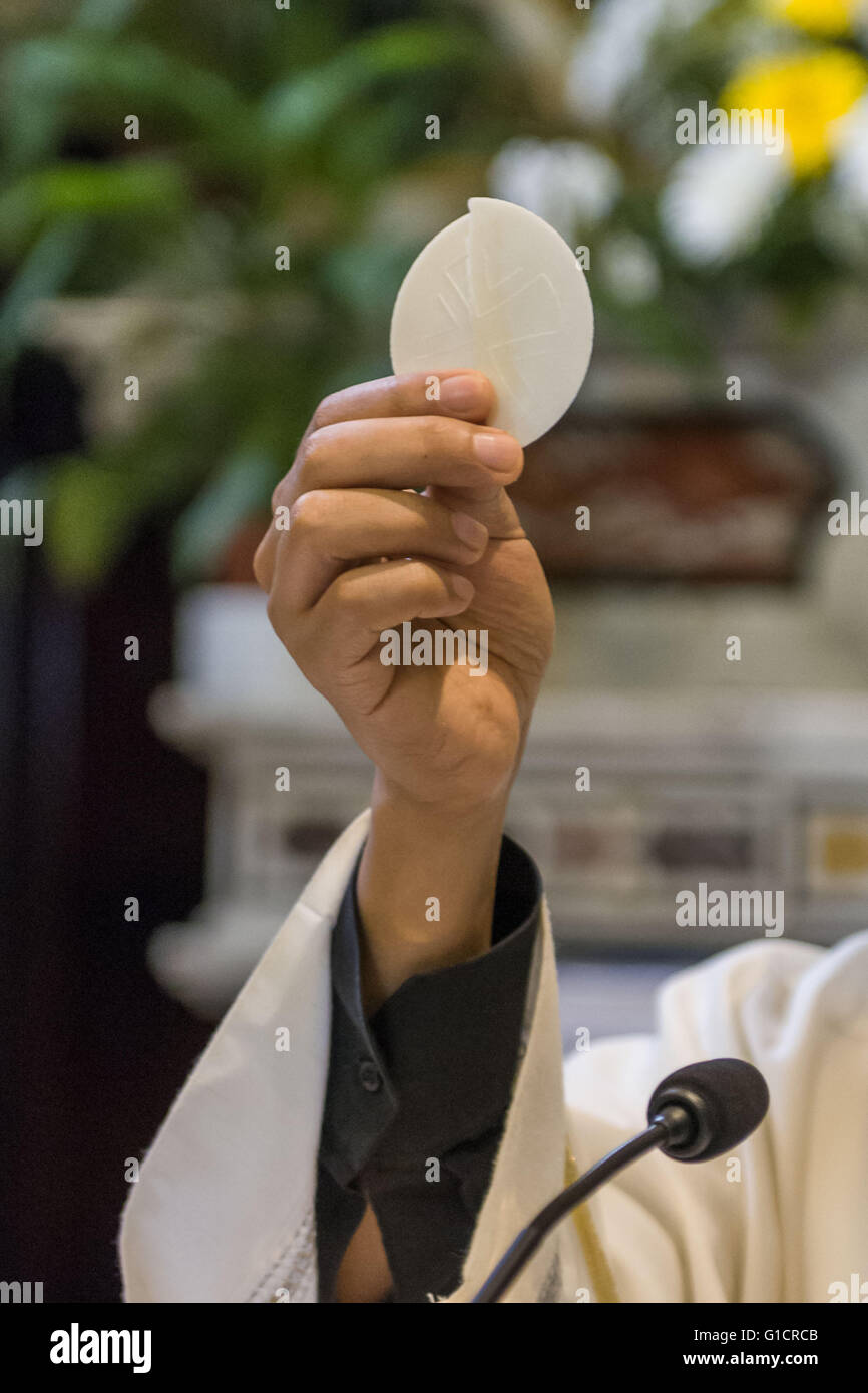 The christian rite of the Communion during the mass Stock Photo - Alamy