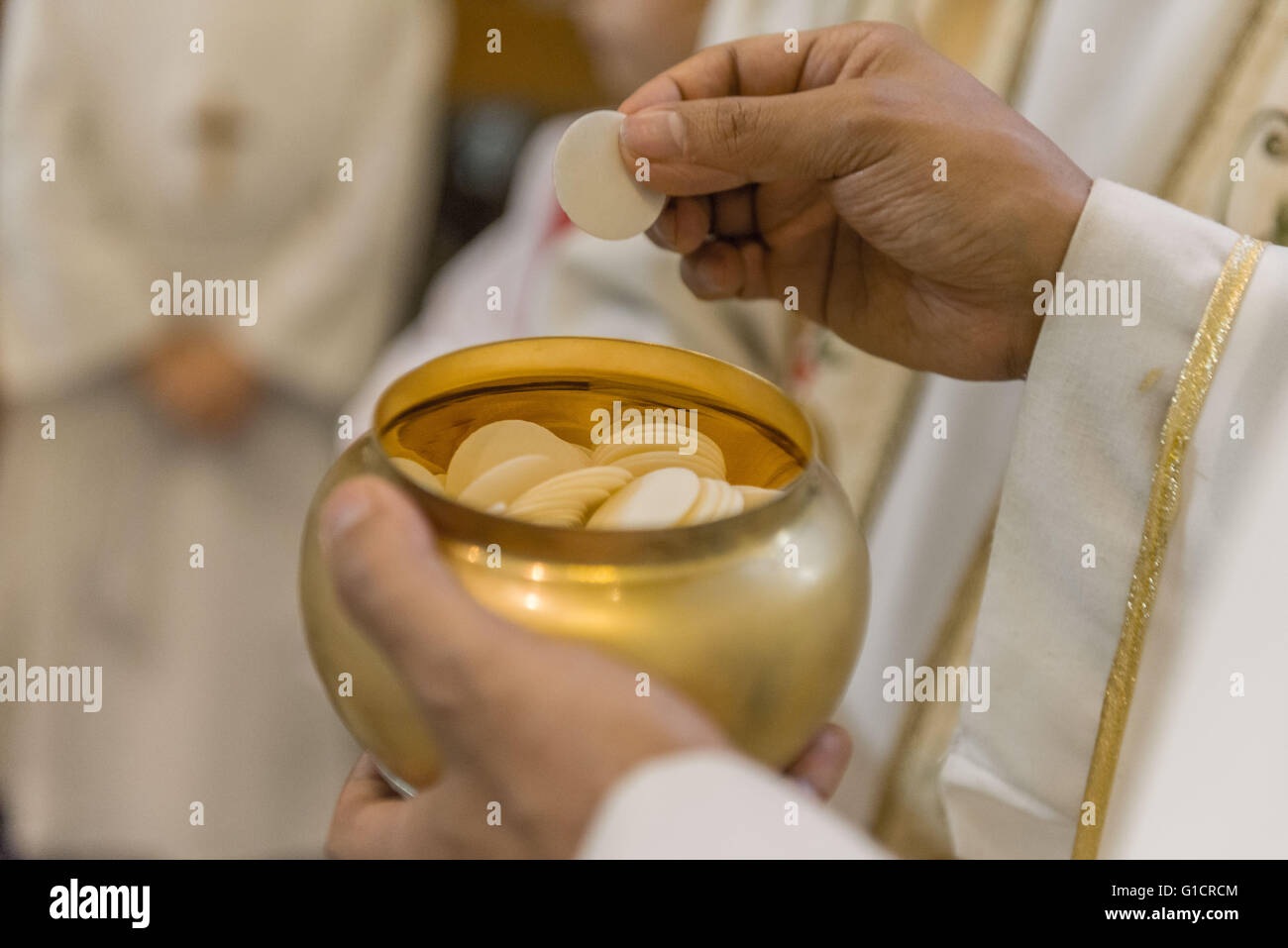 The christian rite of the Communion during the mass Stock Photo - Alamy