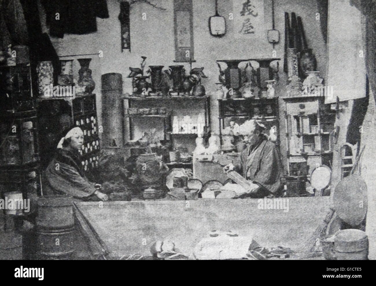 Man and woman in a shop in Tokyo; Japan 1890 Stock Photo - Alamy