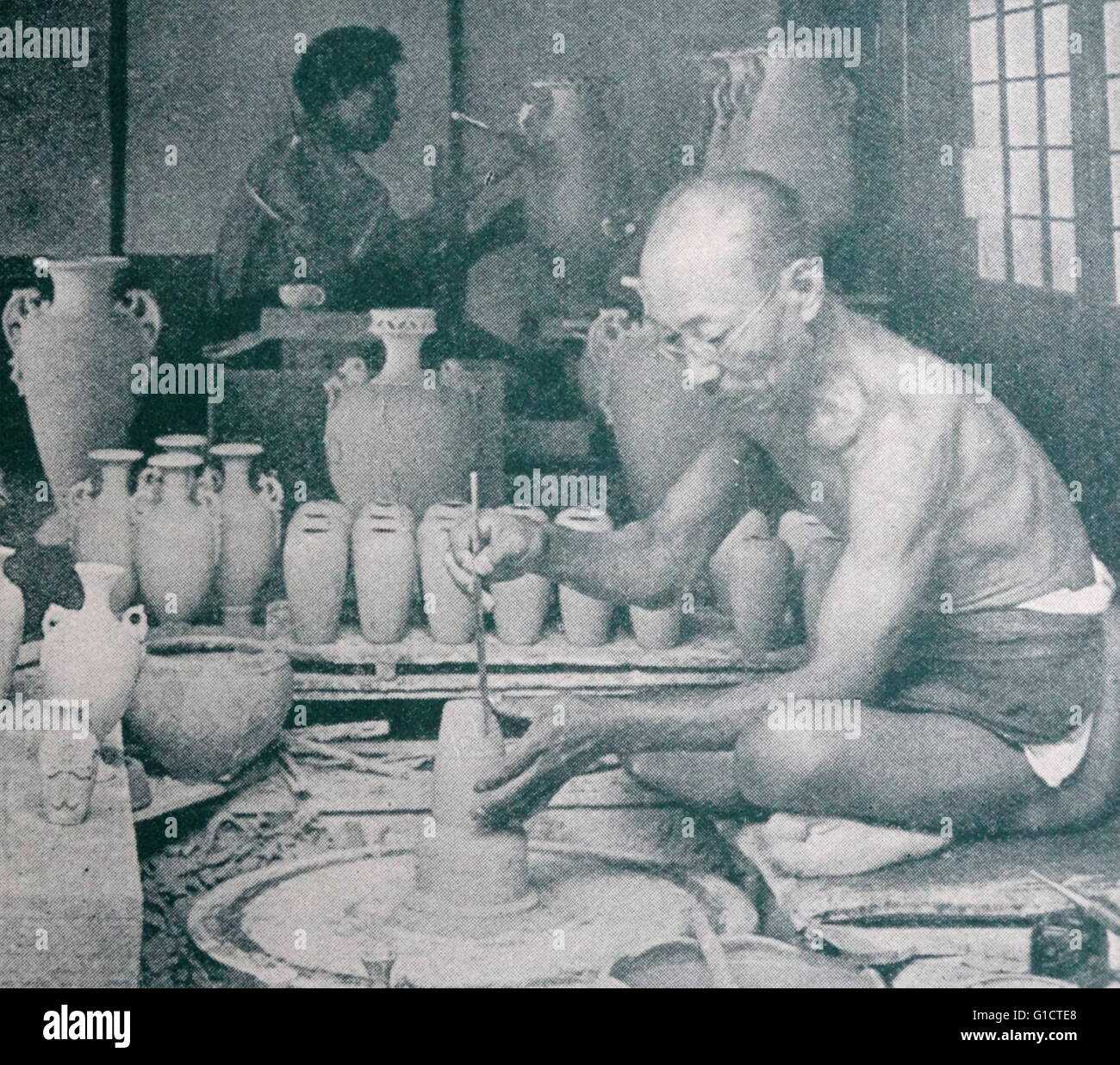Japanese potter painting a vase; Japan 1880 Stock Photo - Alamy