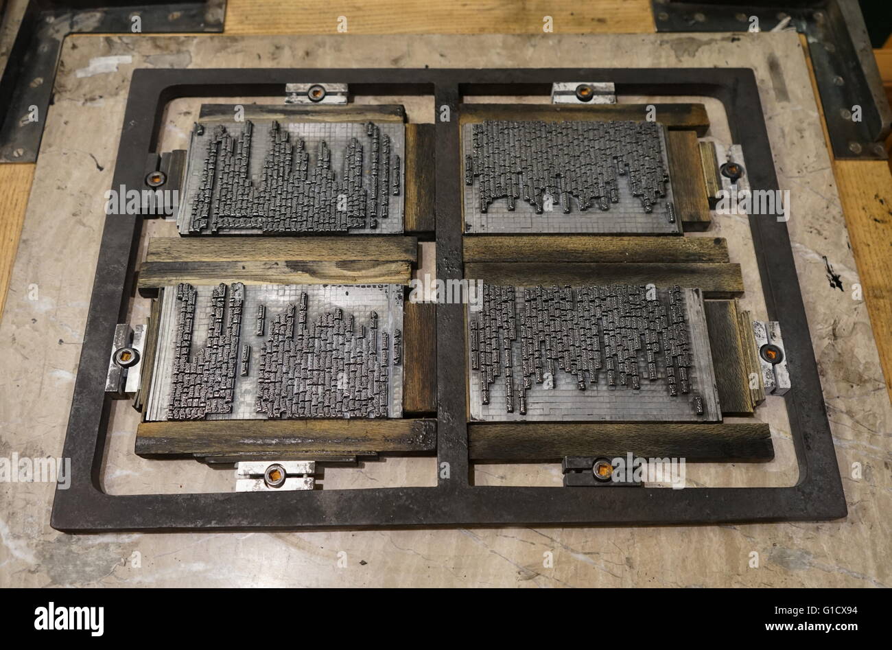 Metal plate with letters set to print a page from a reconstruction of a ...