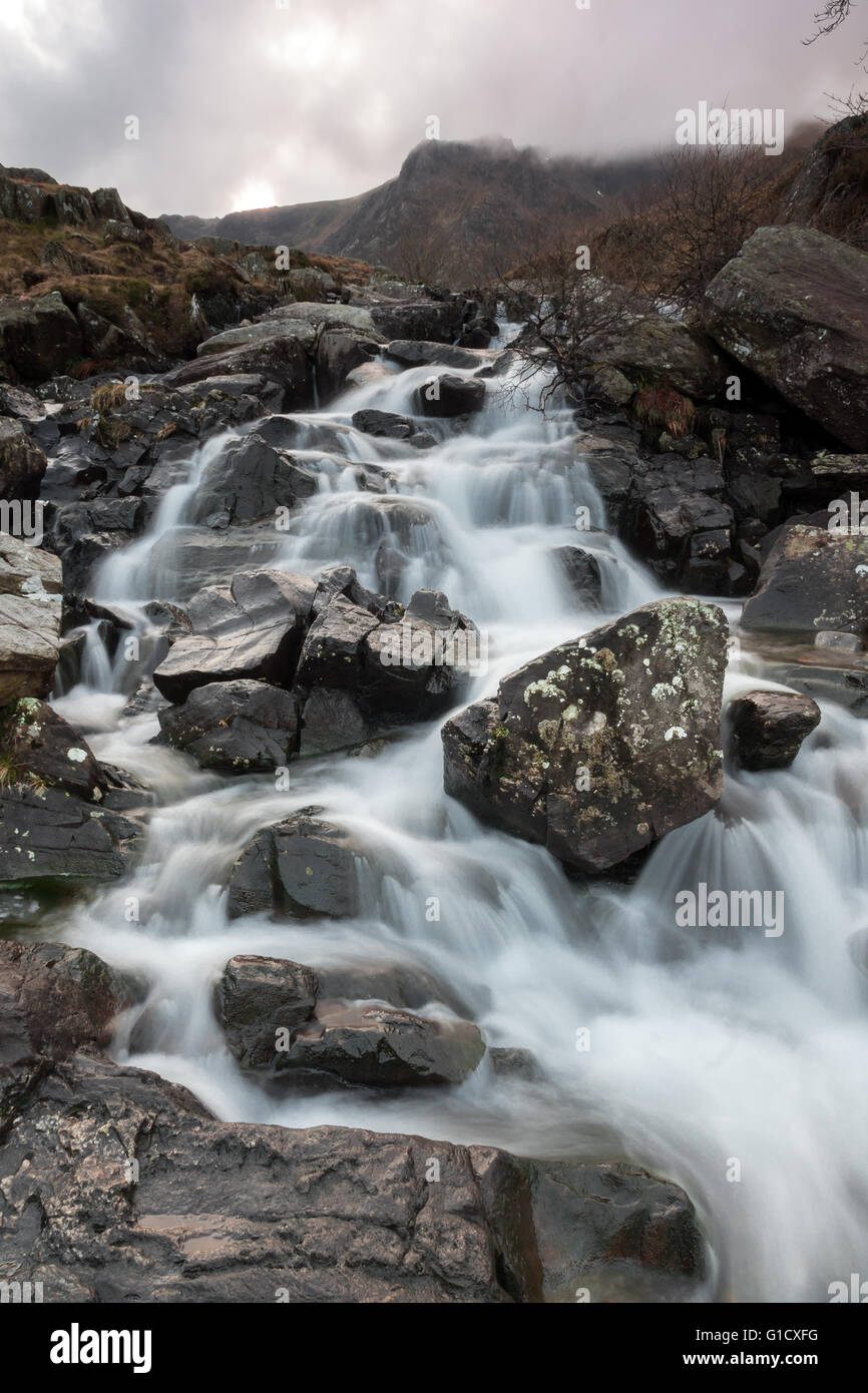 Mountain cascade at Cwm Idwal in the Glyderau range of mountains in ...