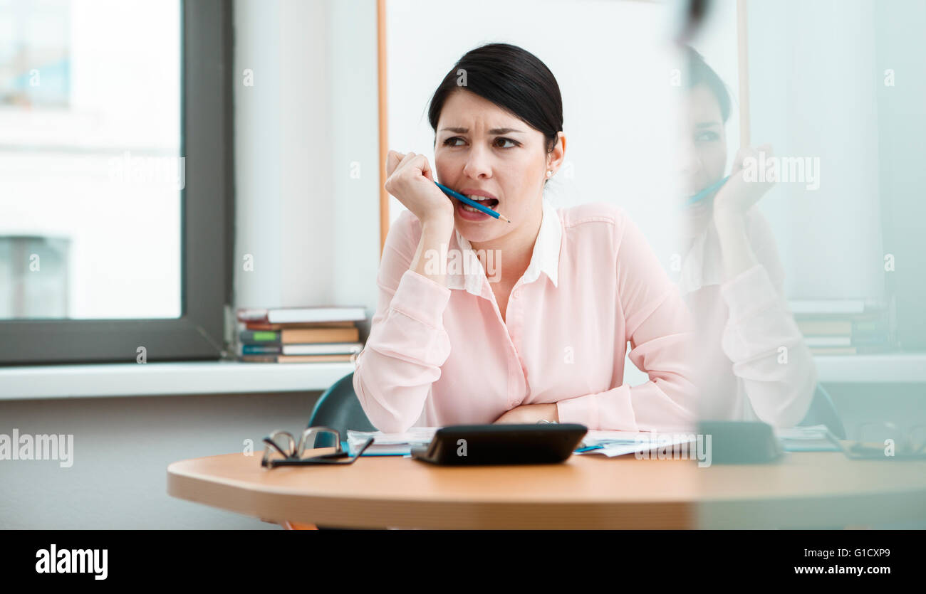 Young office worker dreaming in her workplace Stock Photo - Alamy