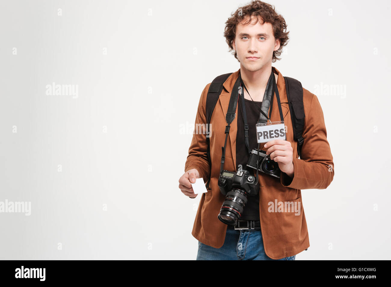 Male reporter holding card with the word press and giving blank card ...