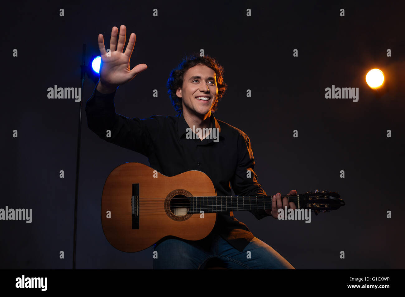 Man holding guitar hi-res stock photography and images - Alamy