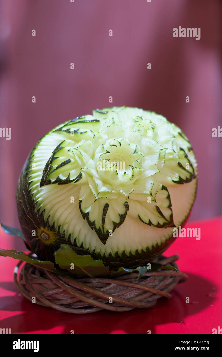 A melon carved with a beautiful flower design Stock Photo - Alamy