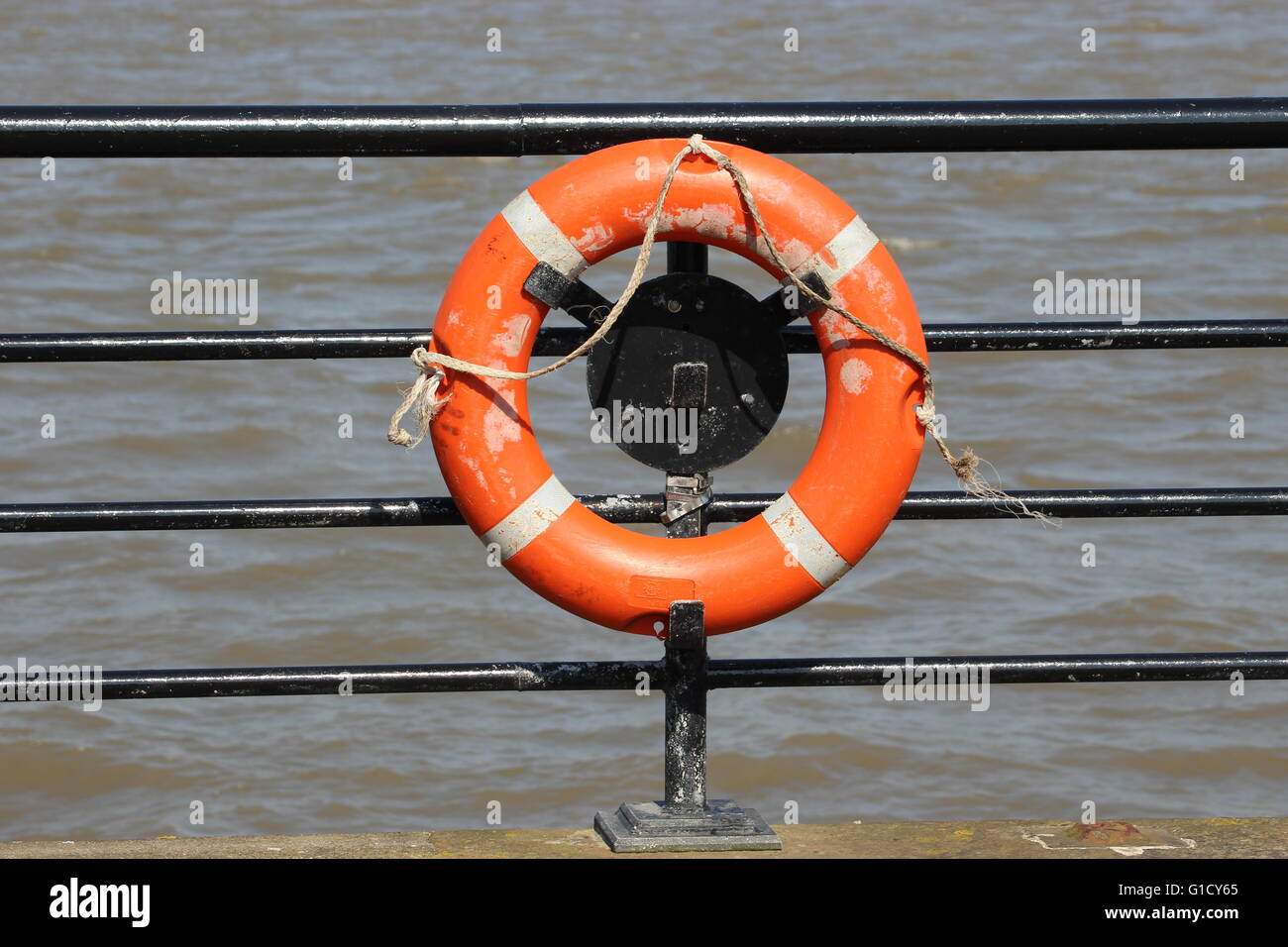 Life saving ring by the sea Stock Photo - Alamy
