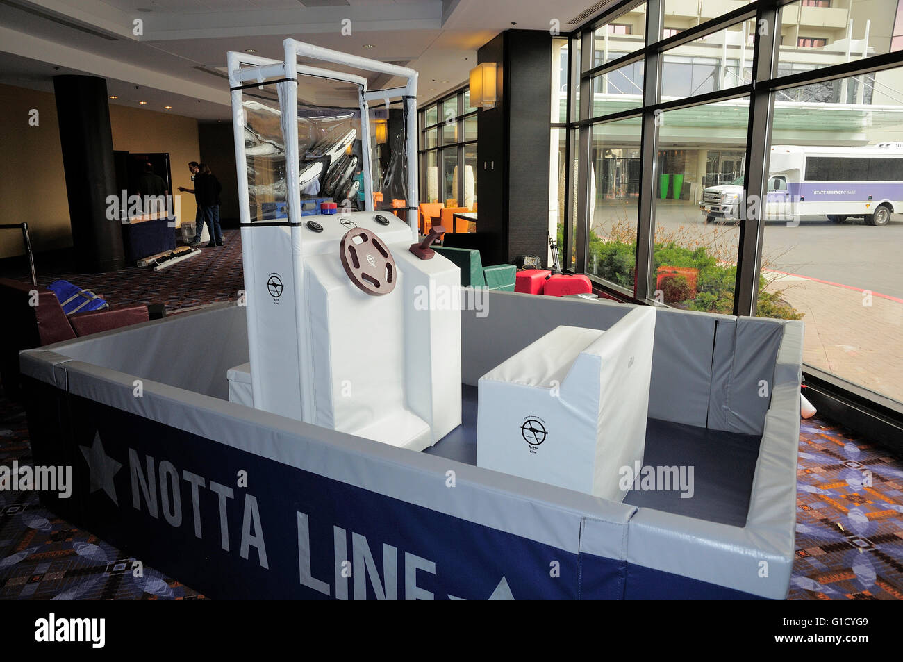 Workers erecting a law enforcement training aid (Center Console foam ...