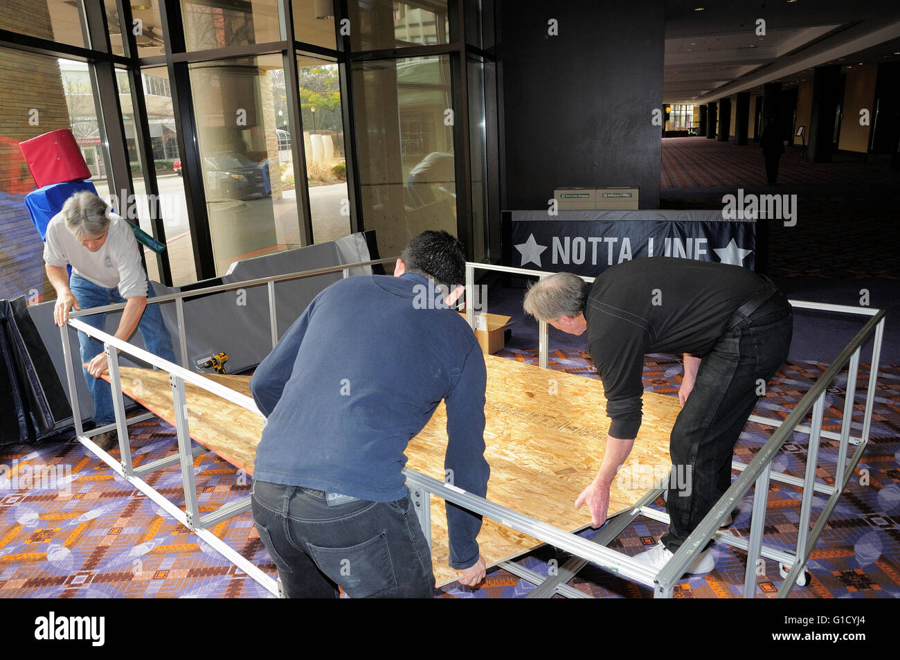 Workers erecting a law enforcement training aid (Center Console foam ...
