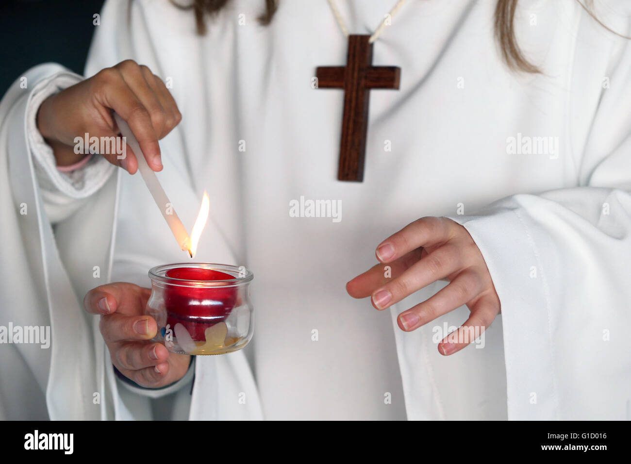 Notre-Dame-du-Val church. Catholic sunday mass. Altar servers lighting ...