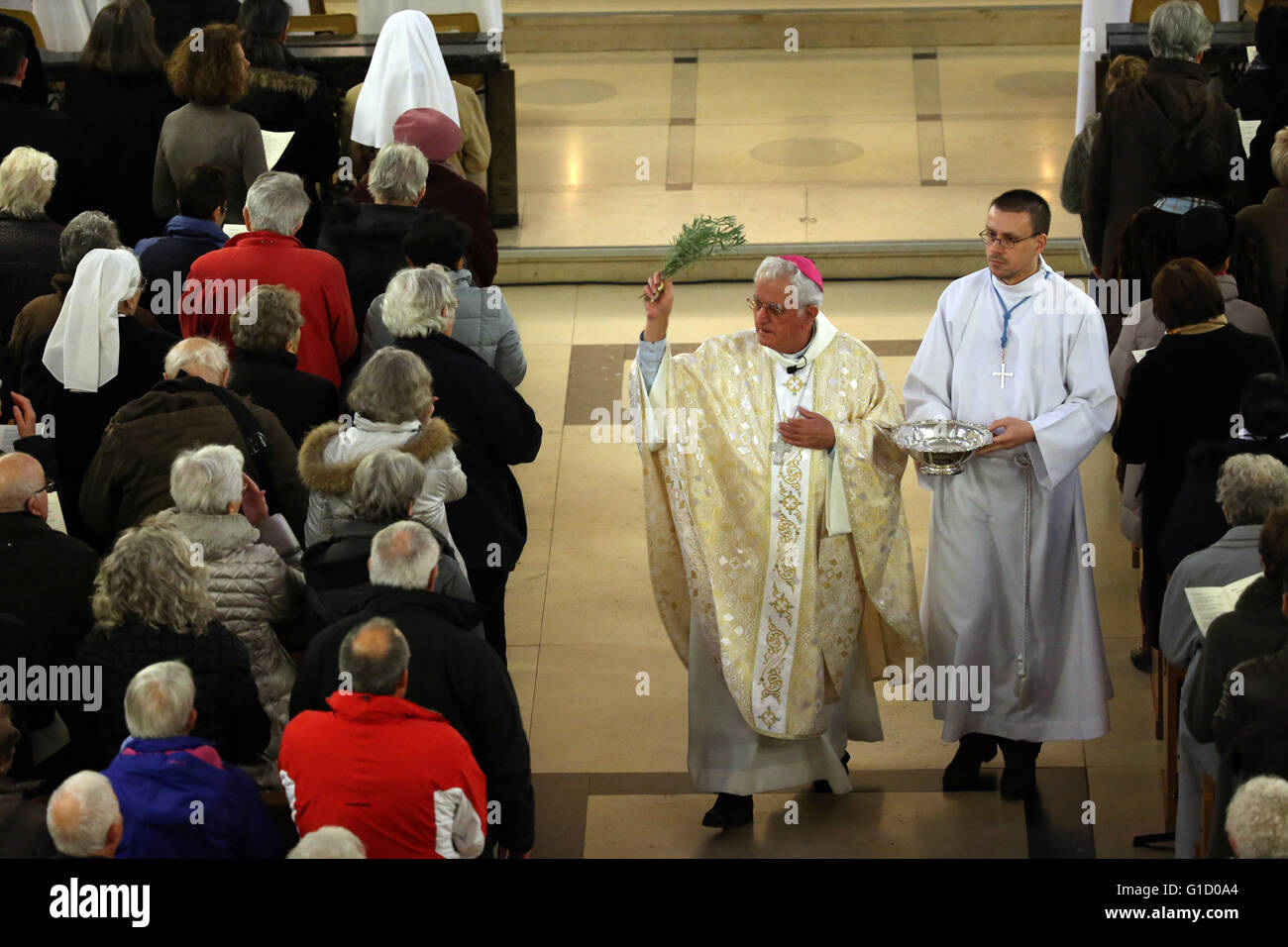 The Basilica of the Visitation. Catholic mass. Sprinkling with holy ...