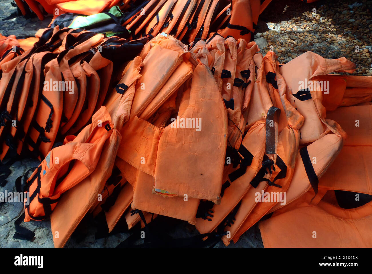 Red vests of safety for sea sports weigh in a row Stock Photo - Alamy