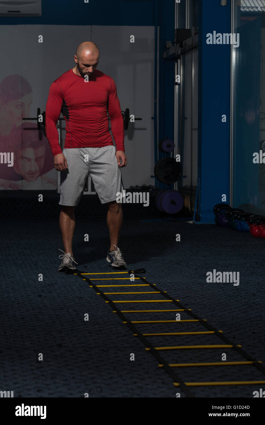 Handsome Man Running On Step Ladders Lying On Floor - Sports And ...