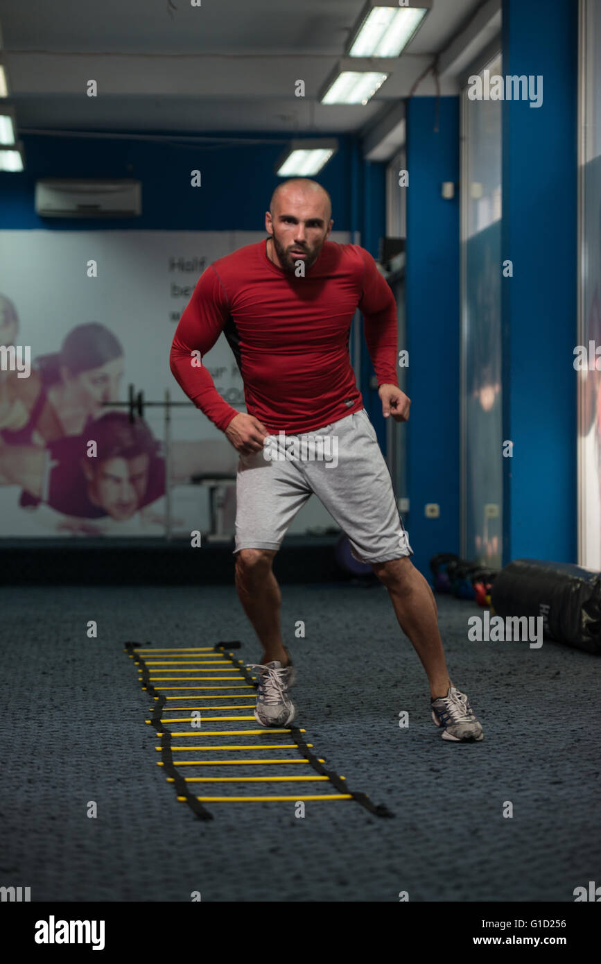 Handsome Man Running On Step Ladders Lying On Floor - Sports And ...