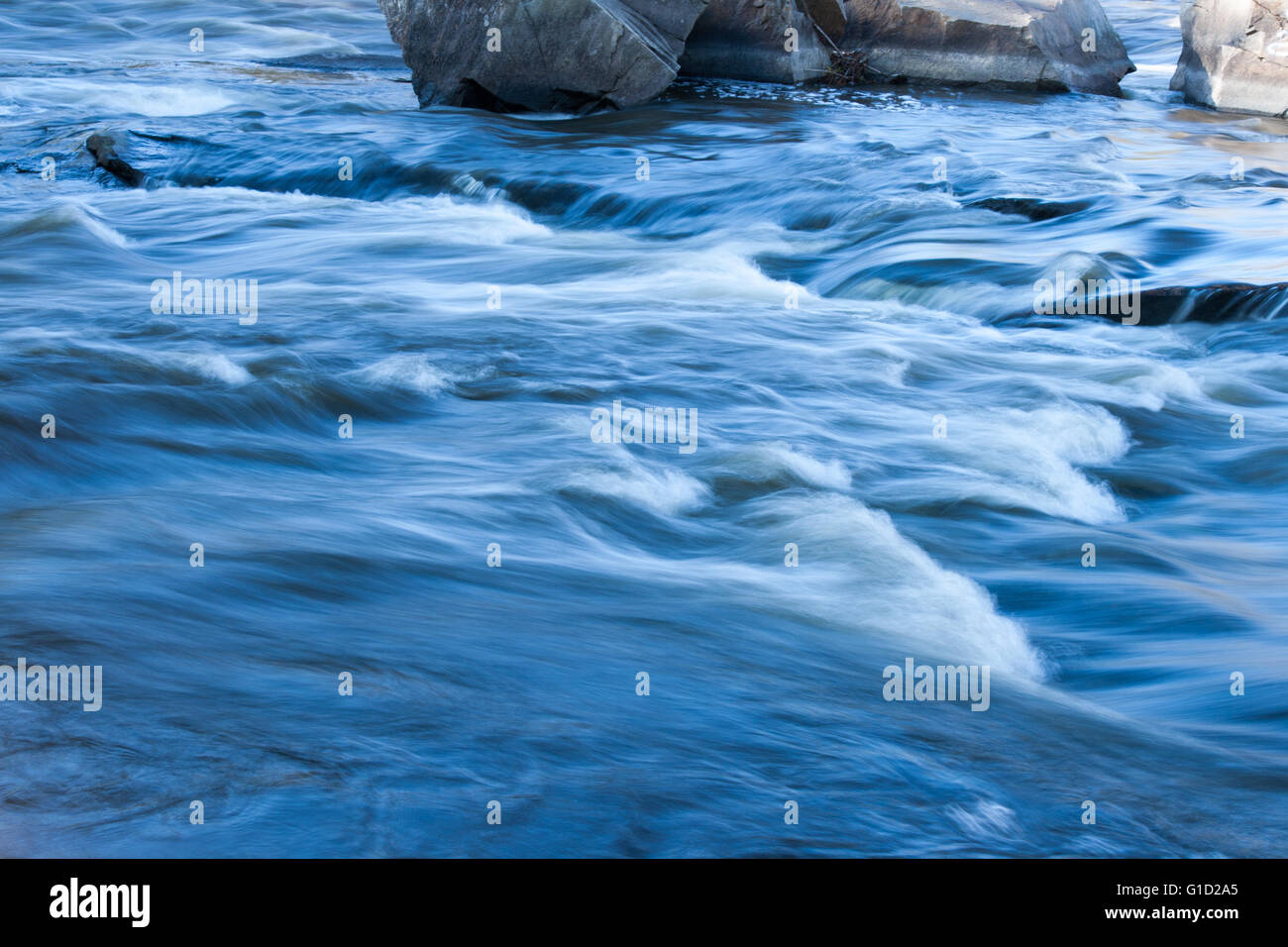 Small section of fast moving water in a creek Stock Photo - Alamy