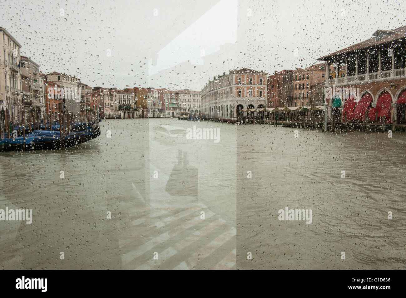 Venice in the rain, through the glass at a Vaporetto stop Stock Photo ...