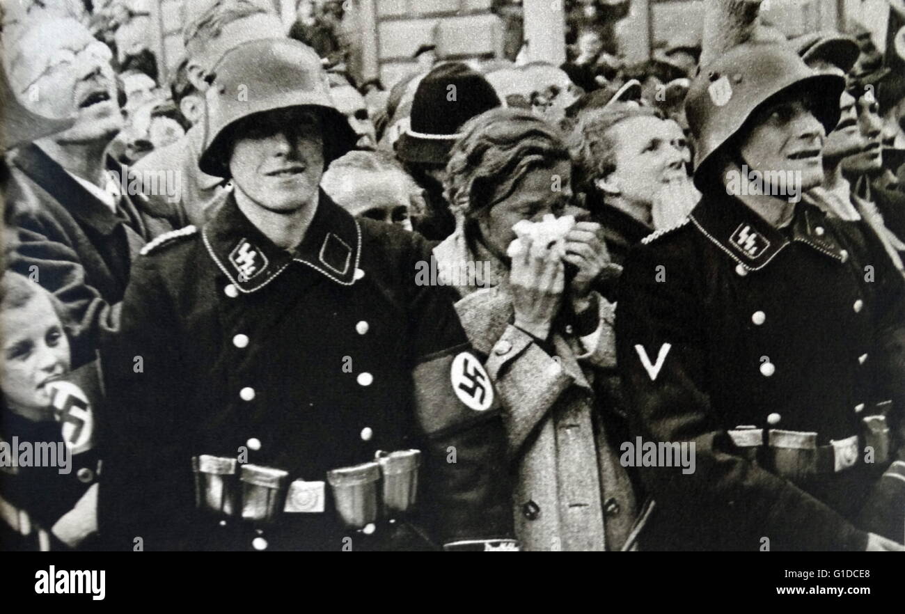 Photographic print of Austrian civilians standing behind an S.S ...