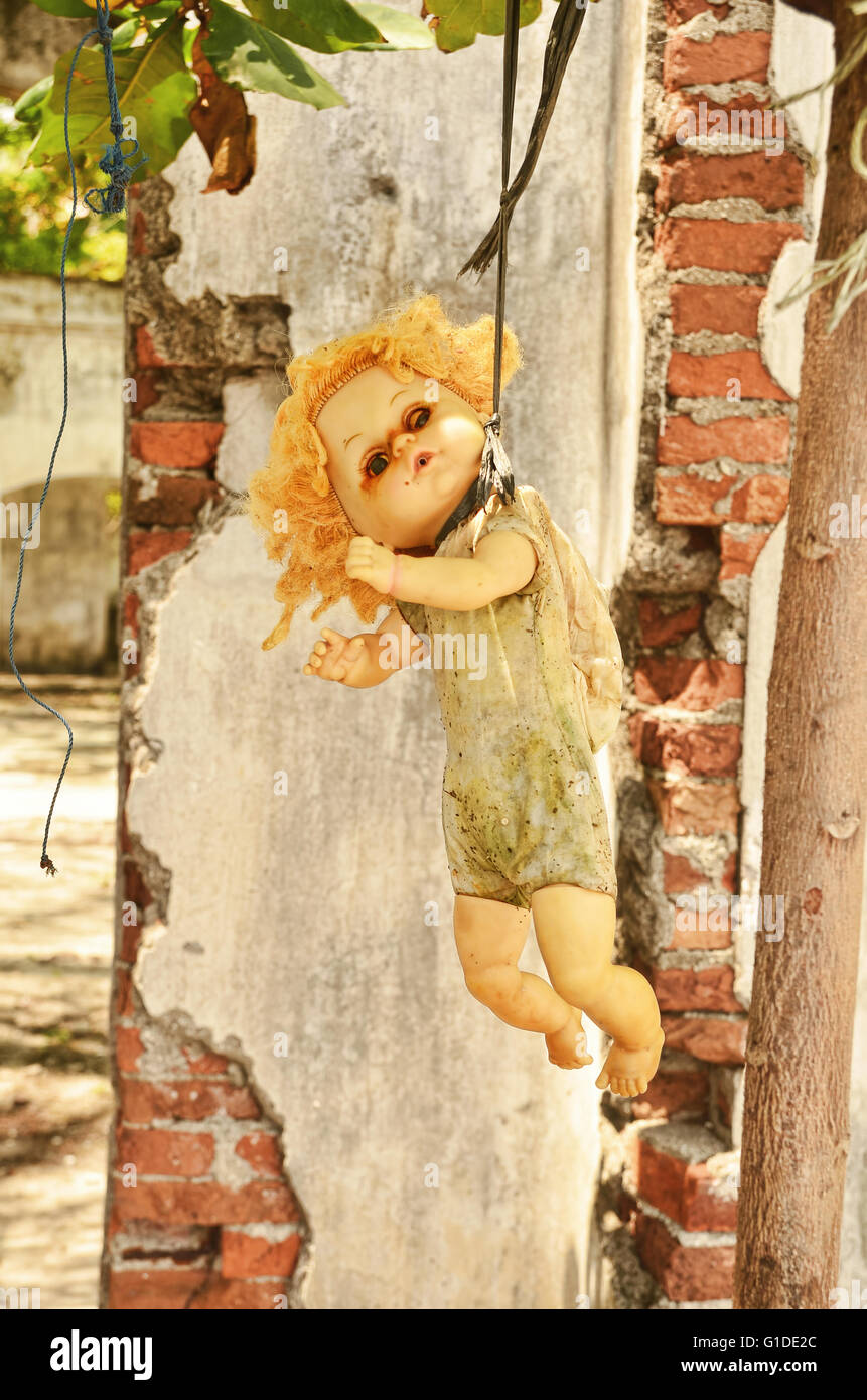 Horror doll hanging on the tree Stock Photo - Alamy