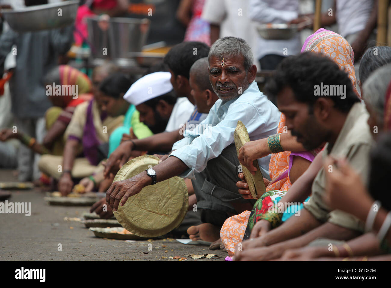 Pune, India - July 11, 2015: Hungry pilgrims called warkaris wait to be ...