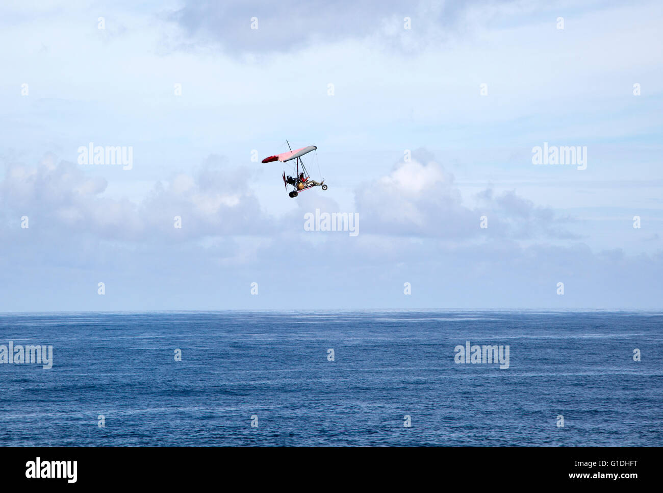 Person flying microlight plane over the ocean, Caleta de Caballo ...