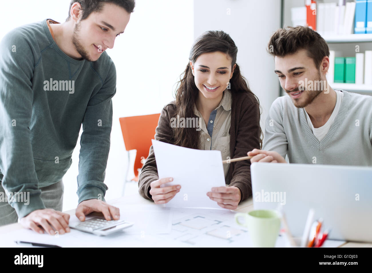 College students working together on a project, education and learning ...