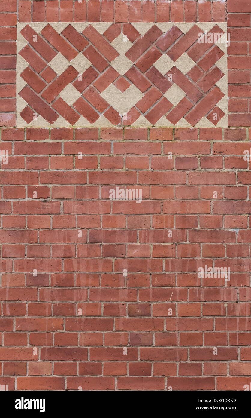 Texture of red brick wall with plastered ornaments Stock Photo - Alamy