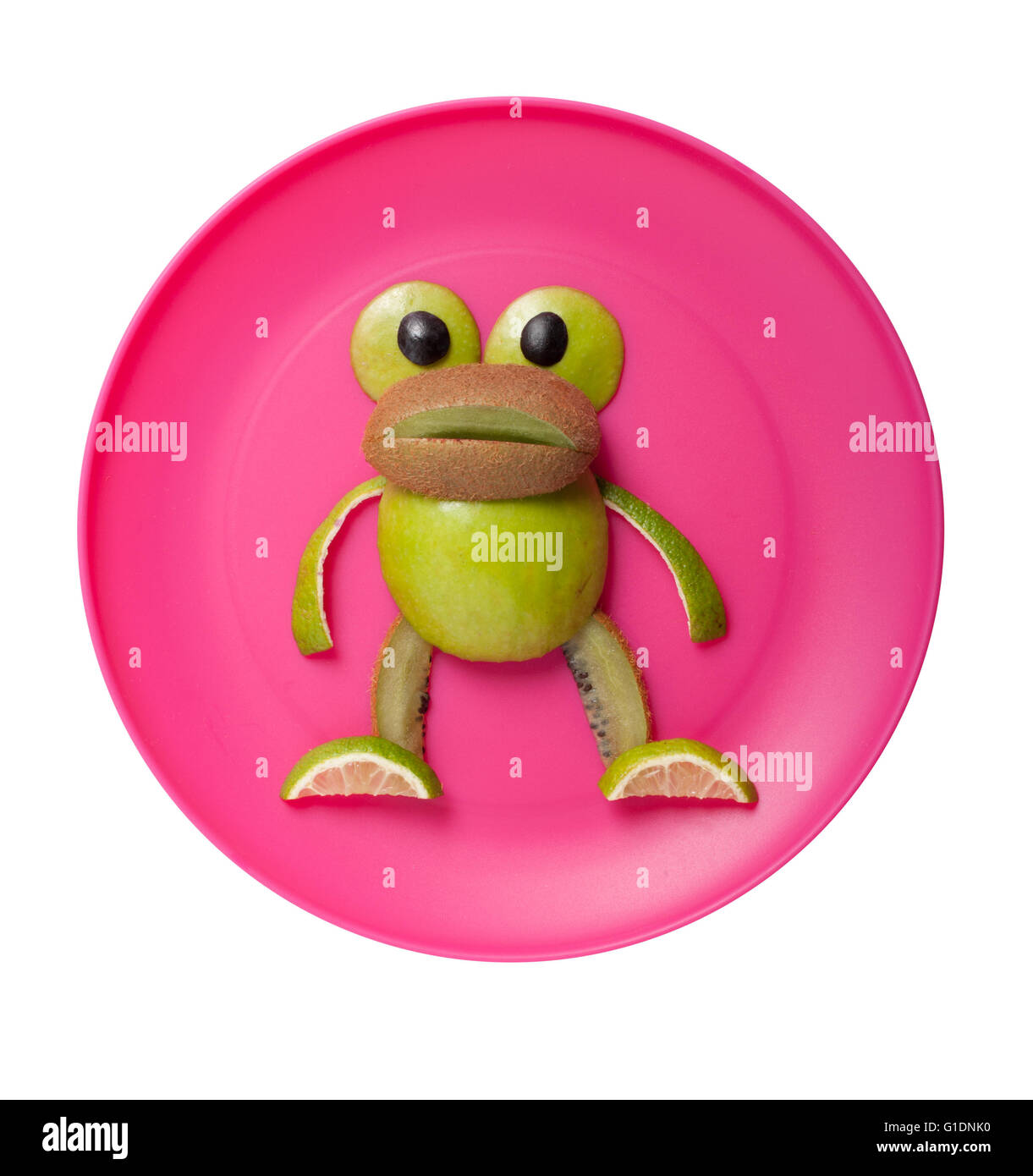 Frog made of kiwi and apple on plate Stock Photo - Alamy