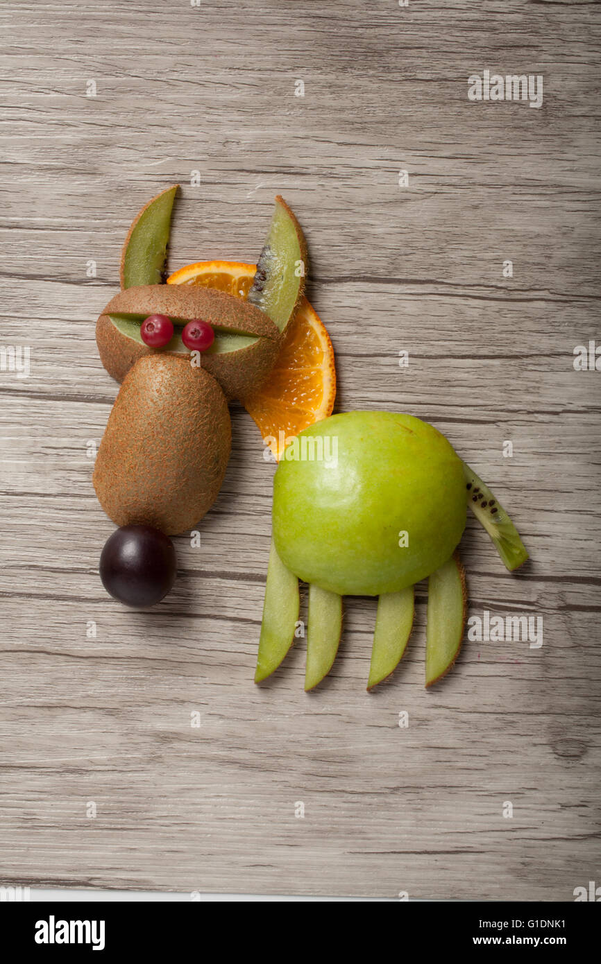 Funny wolf made of fruits on wooden desk Stock Photo - Alamy