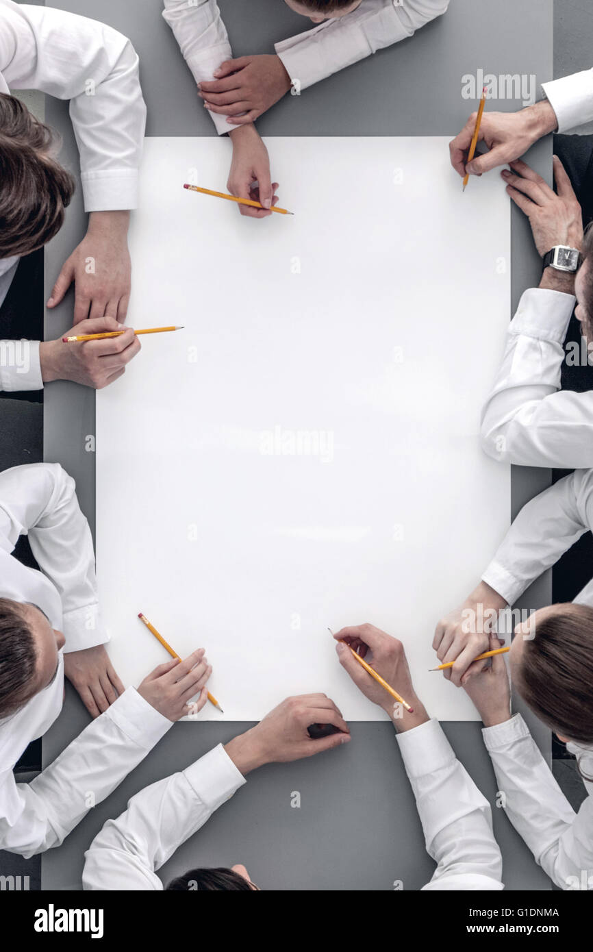 Business people at meeting around the table with blank paper Stock ...