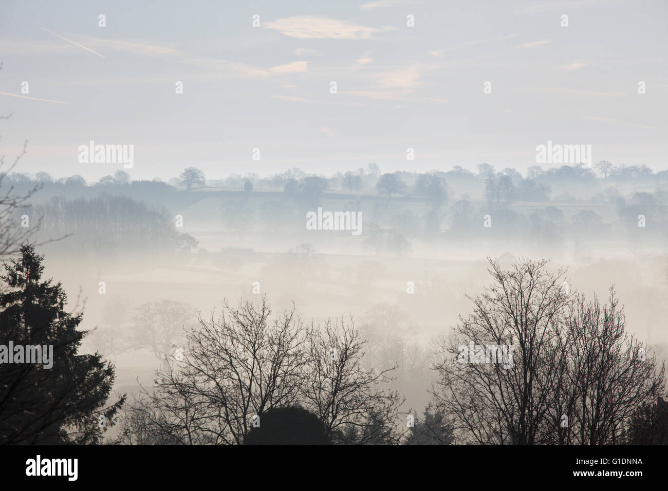 Mist over the weaver hills, Ellastone, Staffordshire, UK Stock Photo ...
