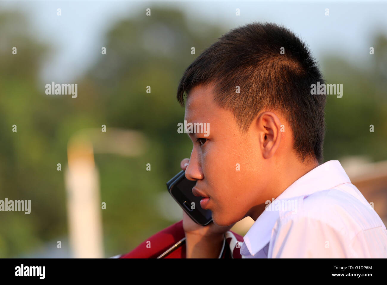 Boy using a mobile phone. Vientiane. Laos Stock Photo - Alamy
