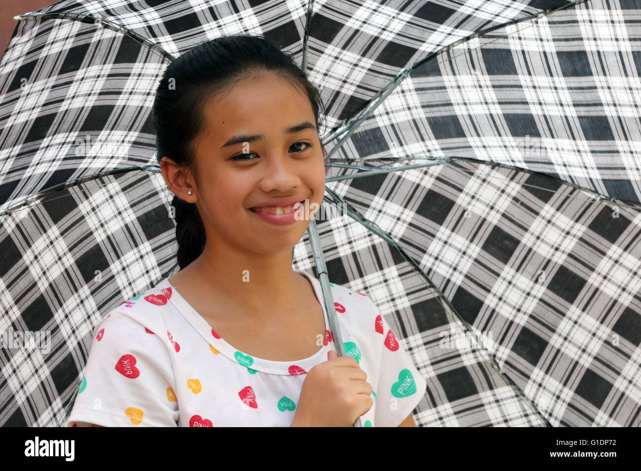Portrait. Gril under umbrella. Vientiane. Laos Stock Photo - Alamy