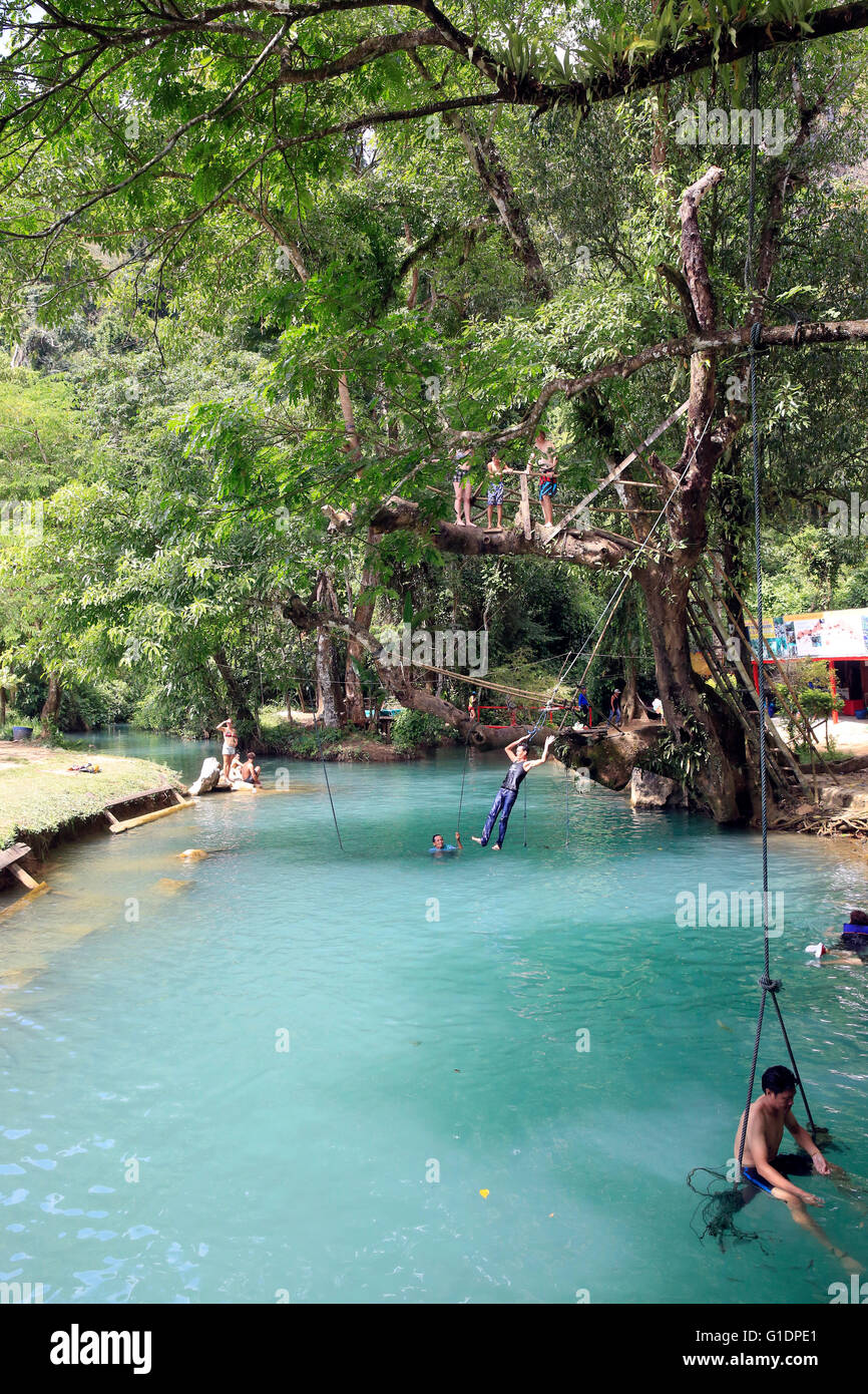 Tham Phu Kham Cave and Blue Lagoon. Vang Vieng.Bathing in clear waters ...