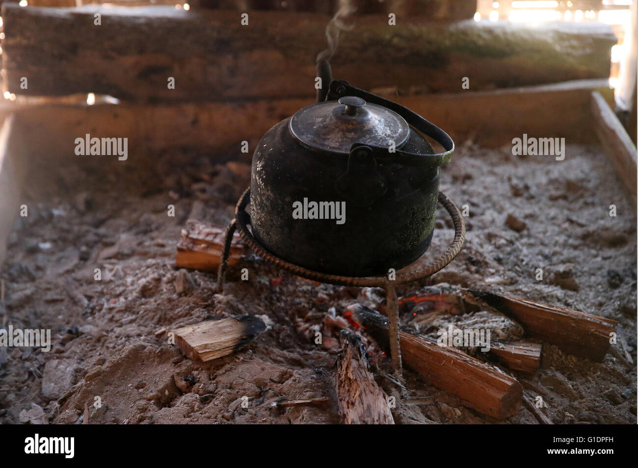 Traditional lao village. Kettle over an open fire in a kitchen made of ...
