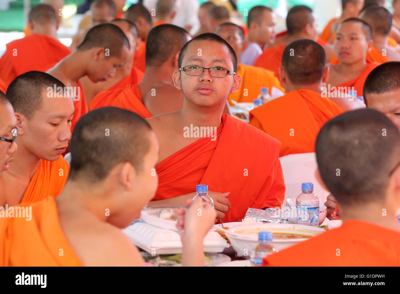 Monk eating in temple vientiane hi-res stock photography and images - Alamy