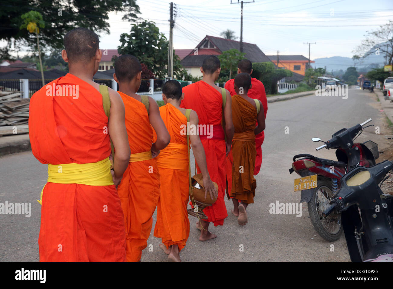 Monks going round for alms. Vang Vieng. Laos Stock Photo - Alamy