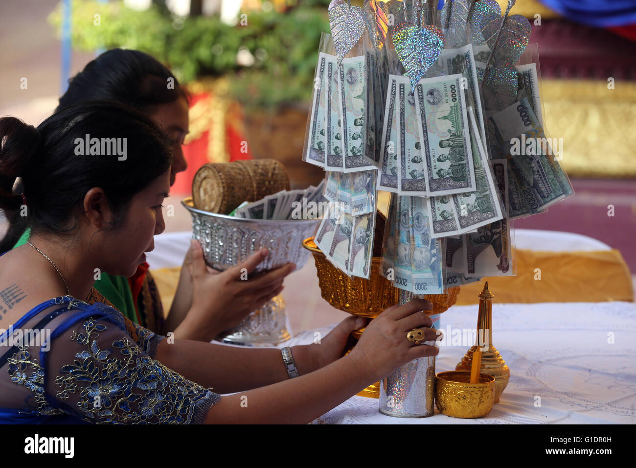 Buddhist money tree merit hi-res stock photography and images - Alamy