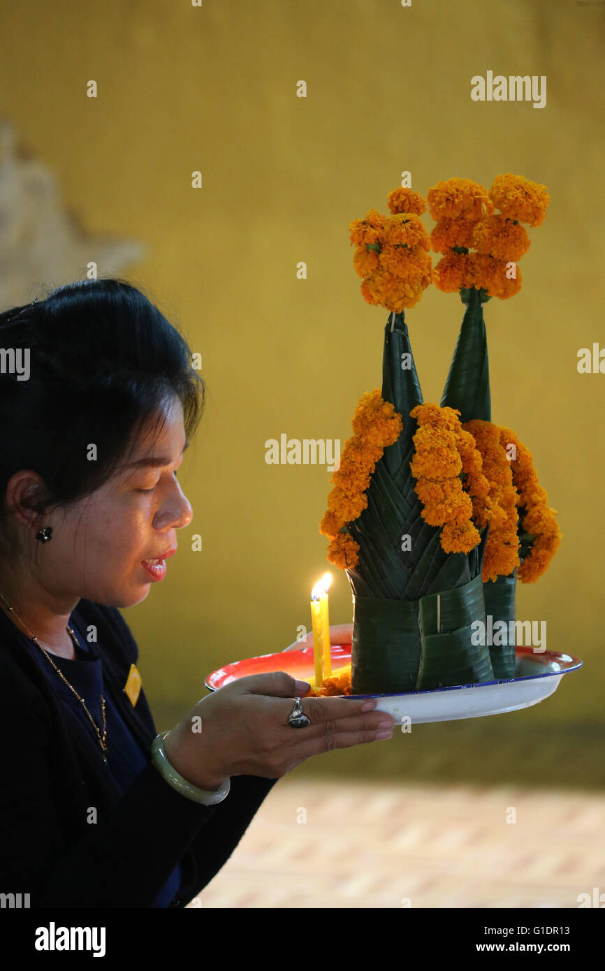 Wat Si Muang ( Simuong) buddhist temple. Buddhist ceremony. Worshiper ...
