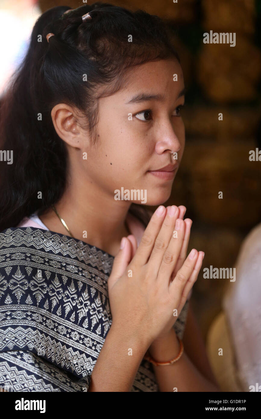 Wat Si Muang ( Simuong) buddhist temple. Buddhist ceremony. Girl ...