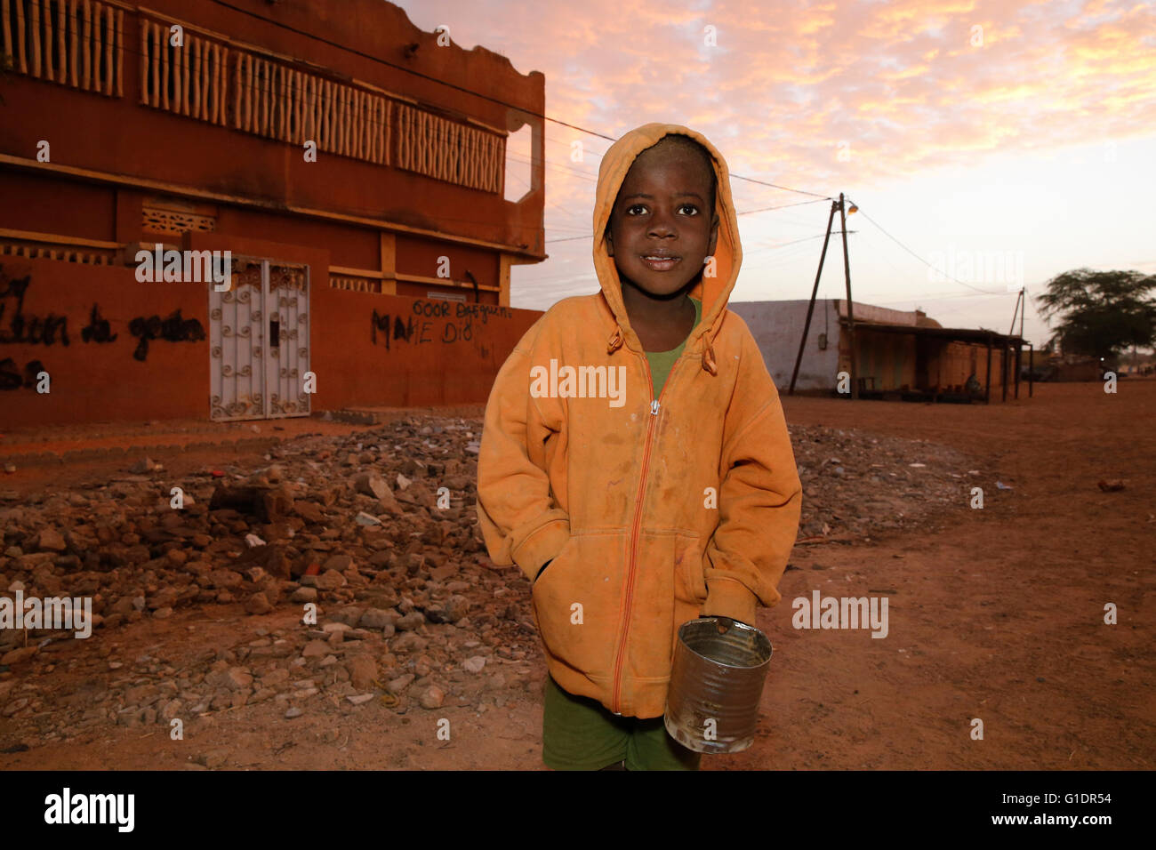 Talibe boy with his alm box. Richard Toll. Senegal Stock Photo - Alamy