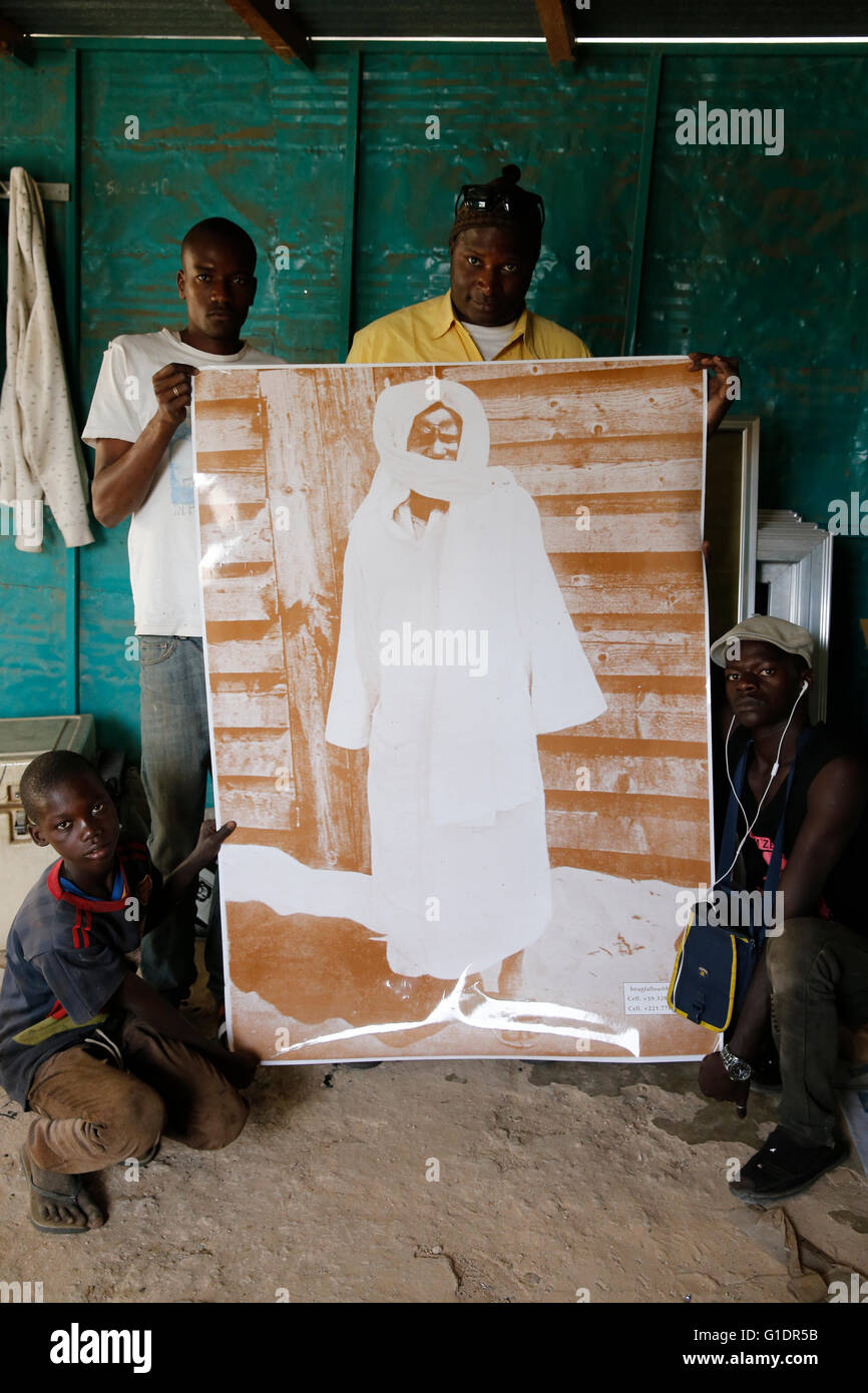 Senegalese Mouride muslims holding a portrait of Sheikh Amadou Bamba ...