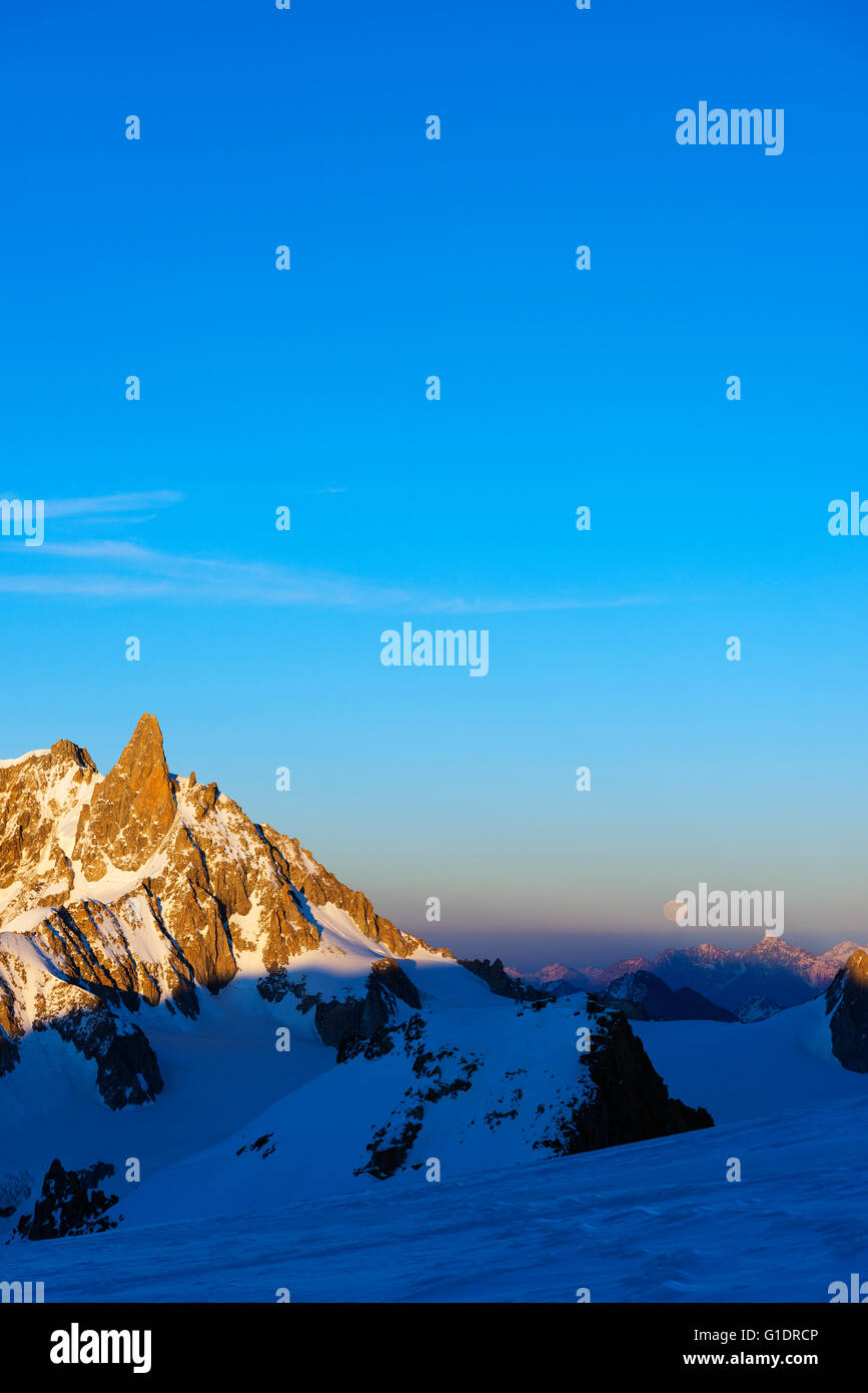 Full moon over snow capped hi-res stock photography and images - Alamy