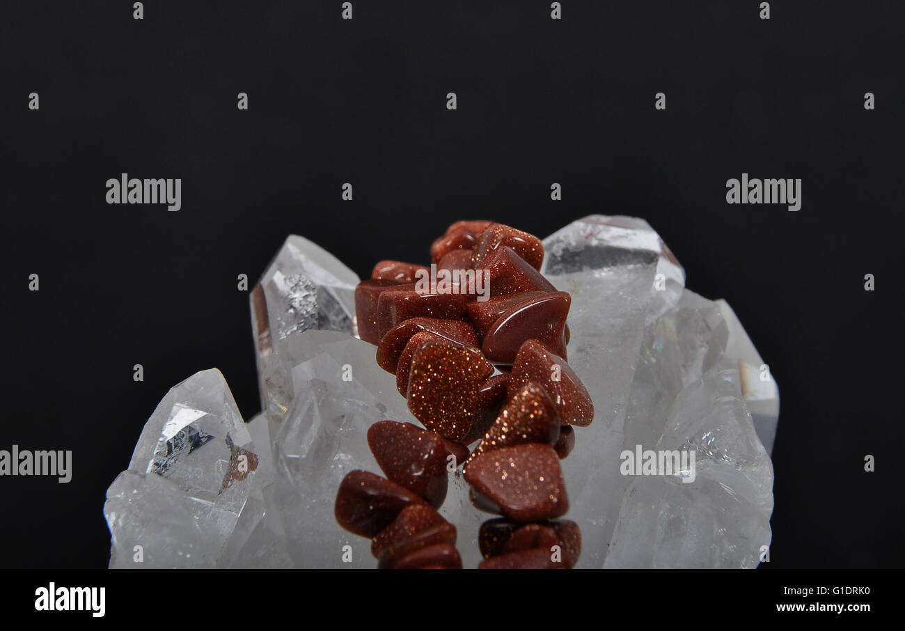 Goldstone on rock crystal Stock Photo - Alamy