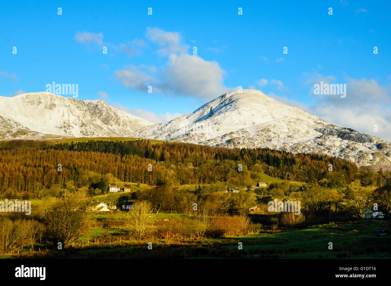Looking over the village of Torver to Dow Crag and Coniston Old Man in ...